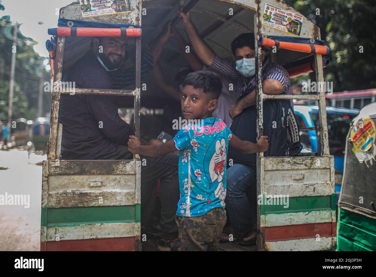 A young boy seen on a human hauler, he works as a helper and a ...