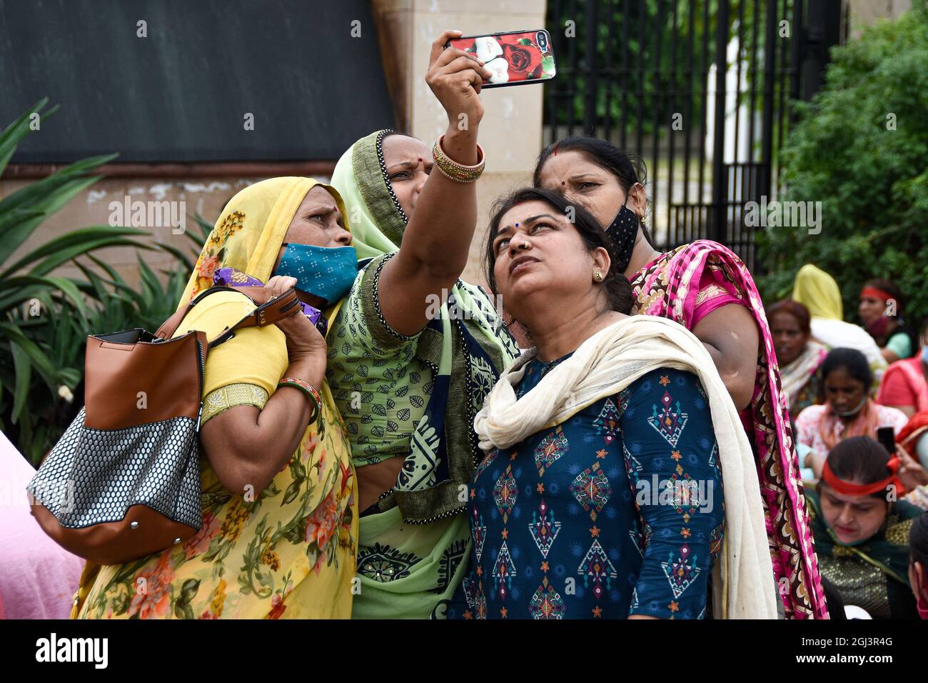 Protesters seen taking selfies during the demonstration.Delhi State ...