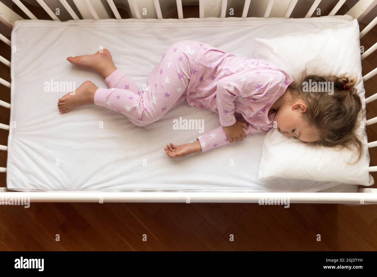 top view Cute little 3-4 years preschool baby girl kid sleeping sweetly ...