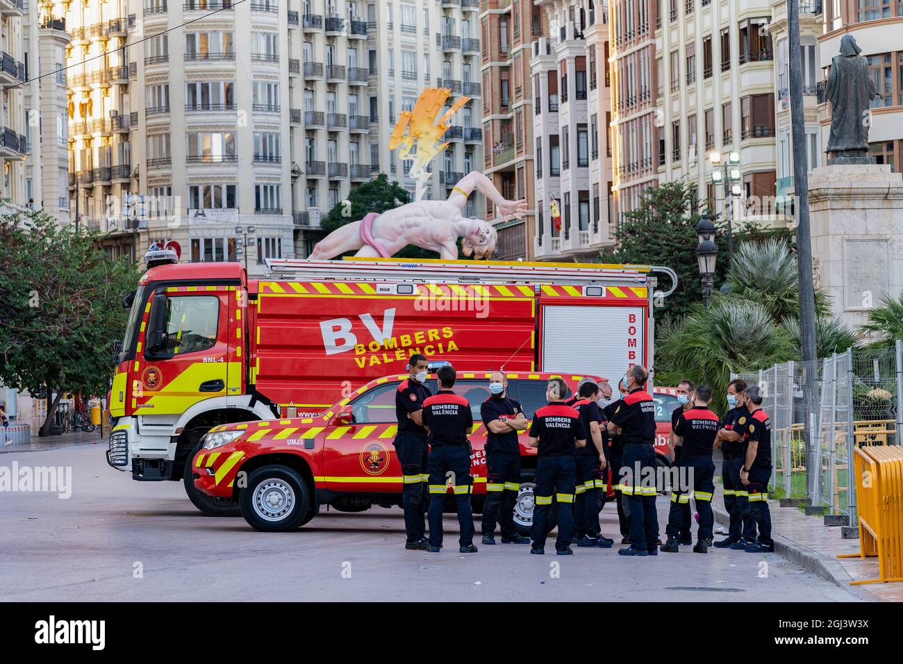 Firefighters prepare to control the fire of the Fallas at the Plaza del ...