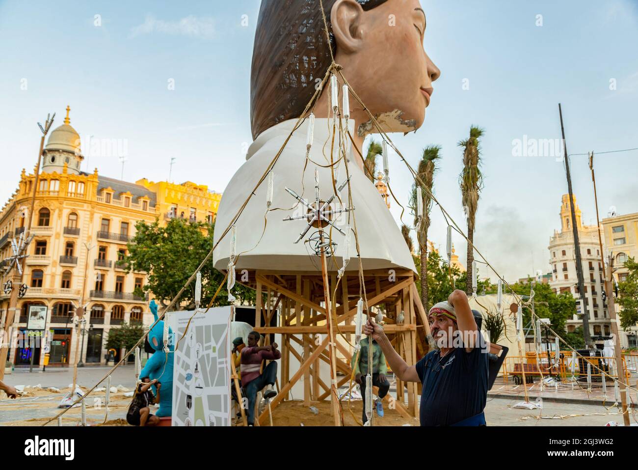 A pyrotechnician prepares fireworks around the municipal Falla at the ...