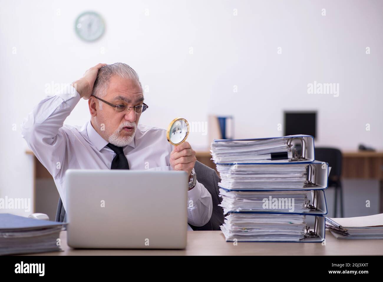 Old auditor working in the office Stock Photo - Alamy