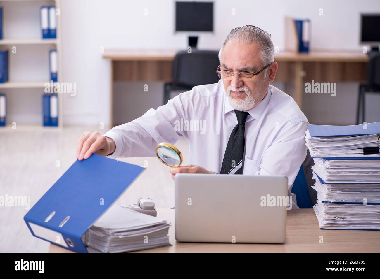 Old auditor working in the office Stock Photo - Alamy