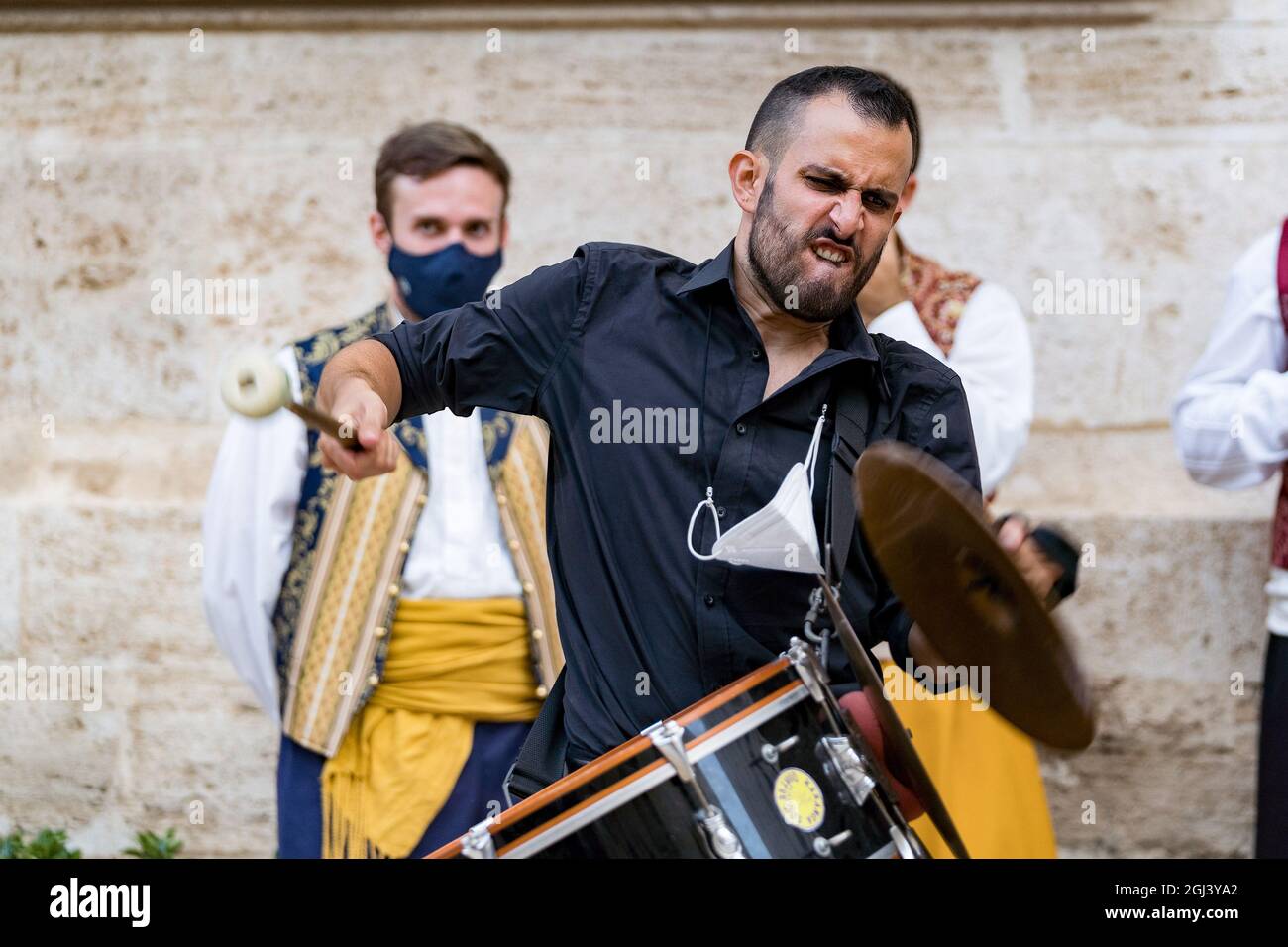 A man in a music band plays drums during the Fallas festival in ...