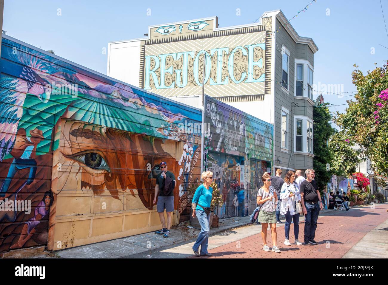 Travelers viewing murals on Balmy Alley at 24th Street in The Mission ...