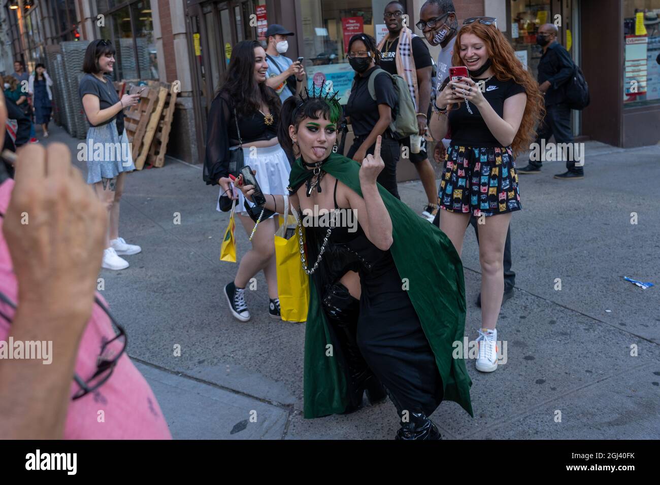 (Editors note image depicts profanity)A pedestrian shows the middle ...