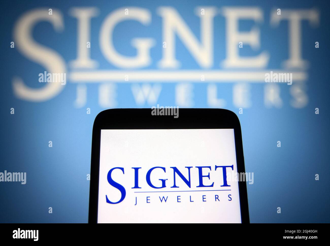 In this photo illustration a Signet Jewelers logo is seen on a ...