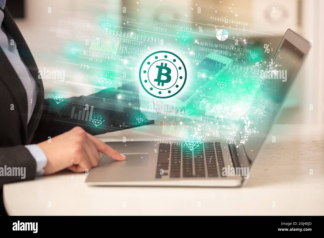 Young man watching stock market on laptop Stock Photo - Alamy