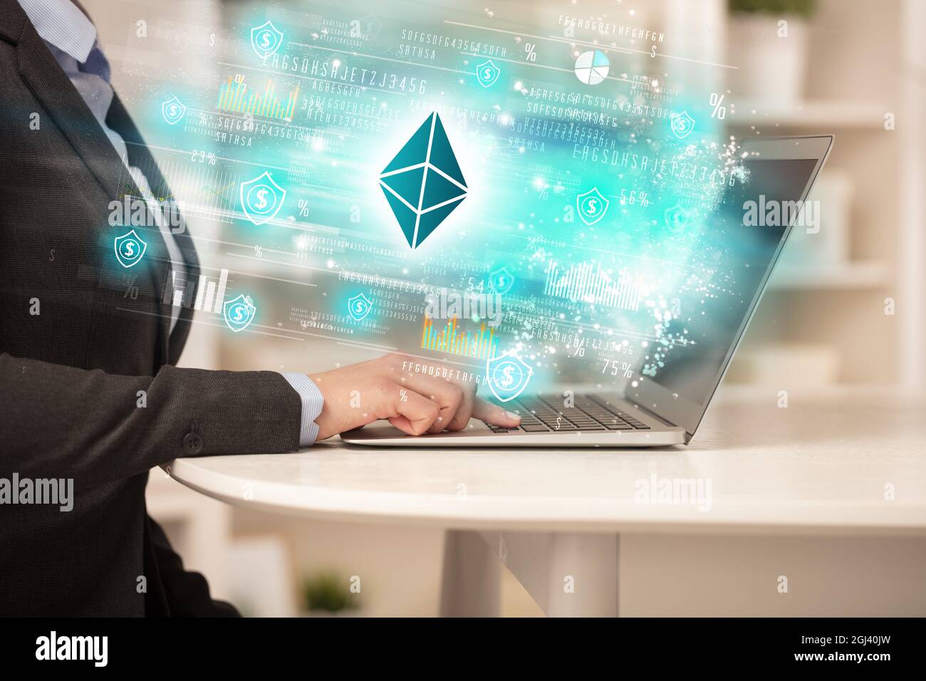 Young man watching stock market on laptop Stock Photo - Alamy