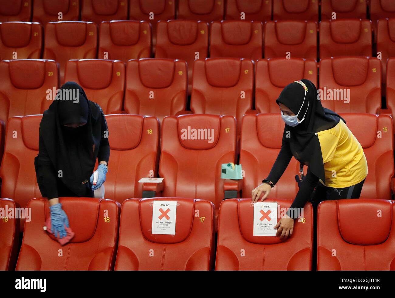 The cinema staff seen sanitizing and put markers on seats to ensure ...