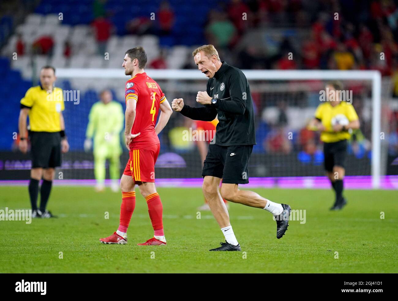 Estonia goalkeeping coach Mart Poom celebrates on the pitch at the end ...