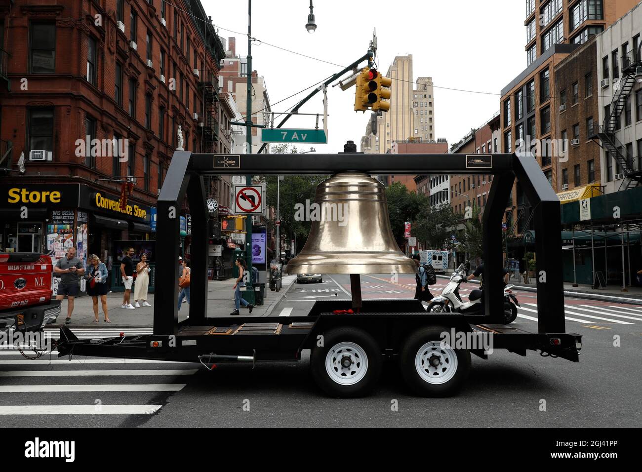A commemorative bell is towed during the 911 Walk of Remembrance from ...