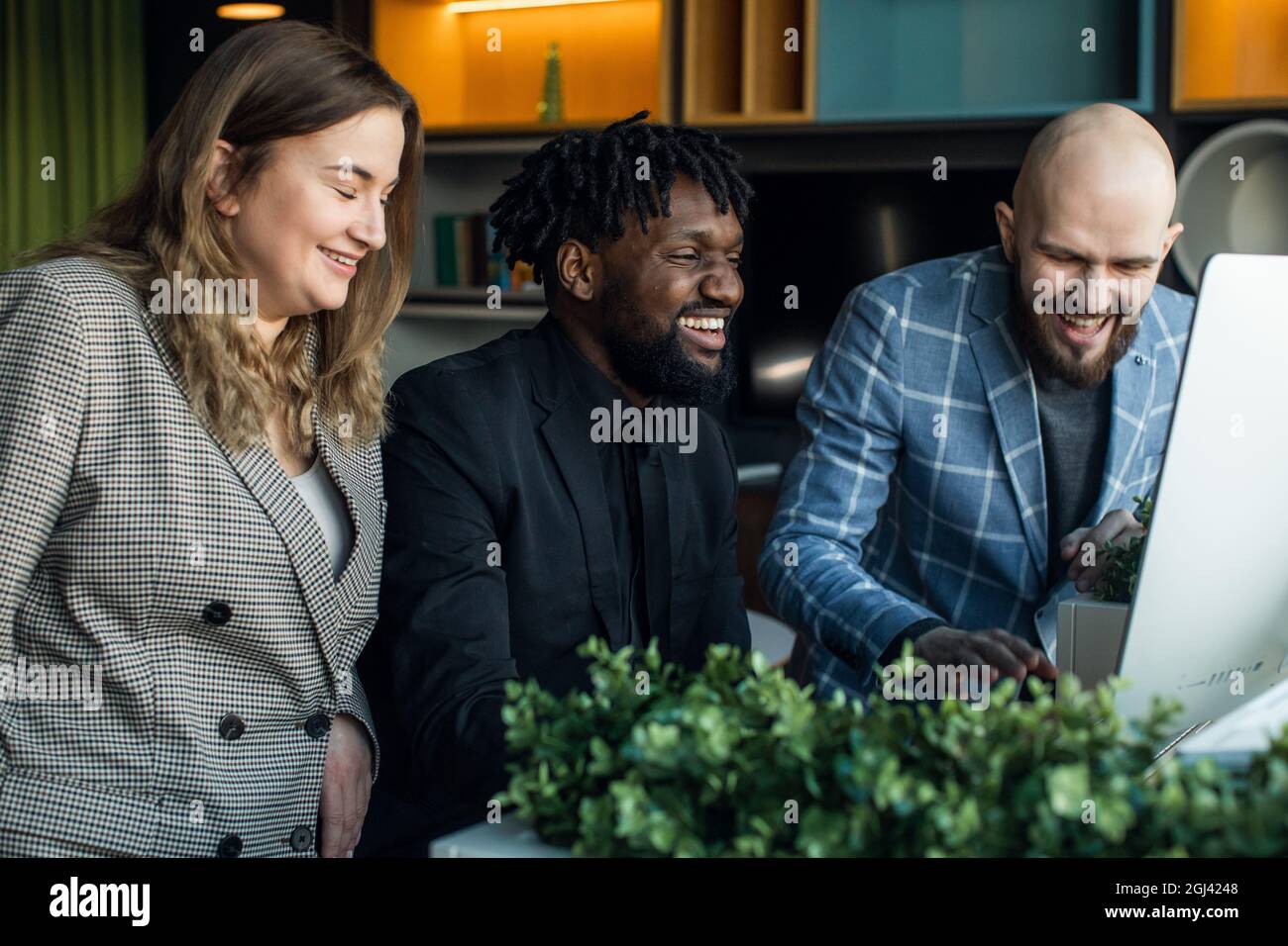 Full assessment at work. Group of young businessmen working and ...