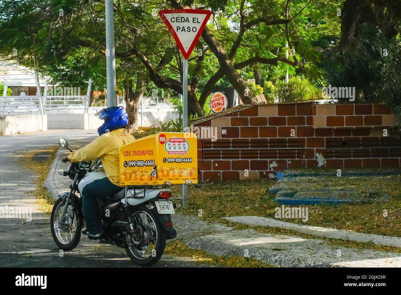Food delivery on motorcycle, Merida Mexico Stock Photo - Alamy