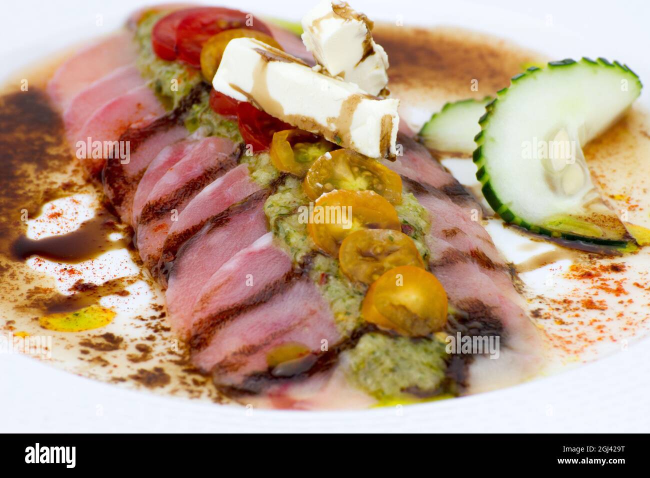 Gourmet food plate with meat and feta Stock Photo - Alamy