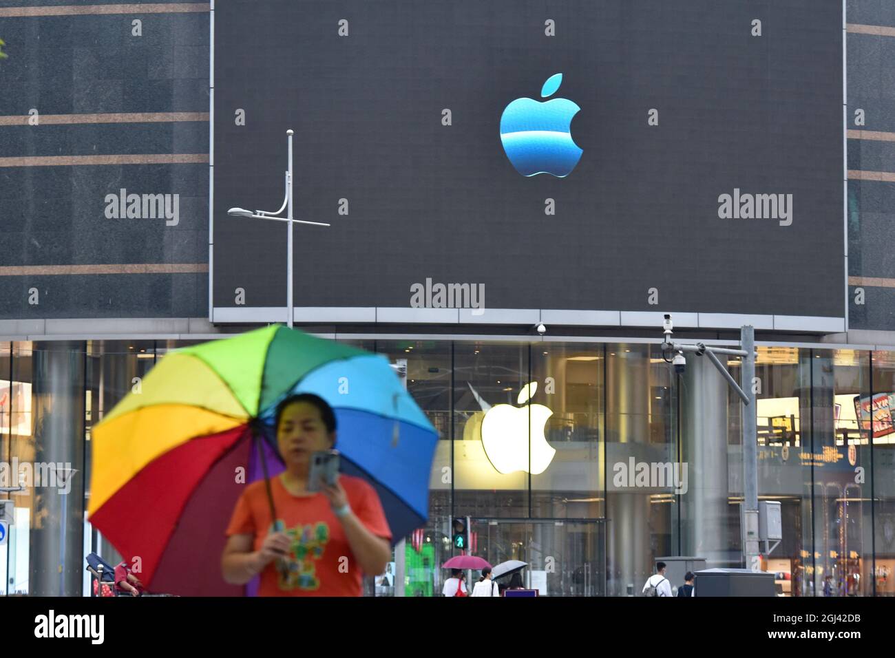 An Apple logo seen displayed on a large screen outside the Apple store ...