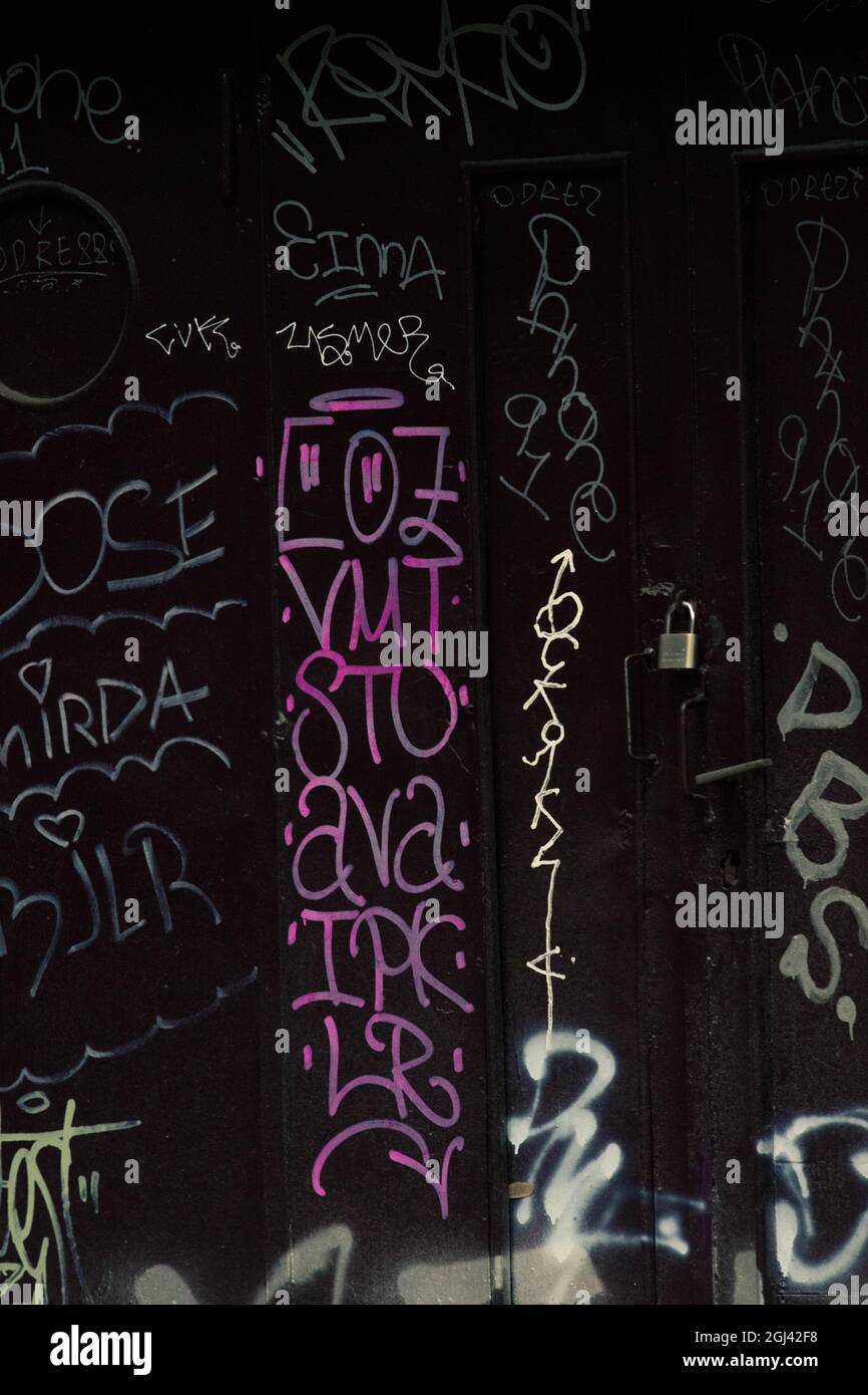 Graffiti written walls in a city street Stock Photo - Alamy