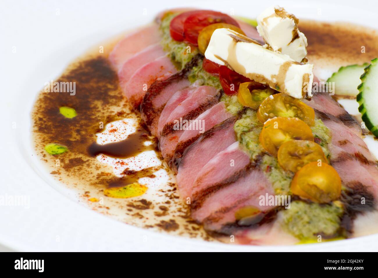 Gourmet food plate with meat and feta Stock Photo - Alamy
