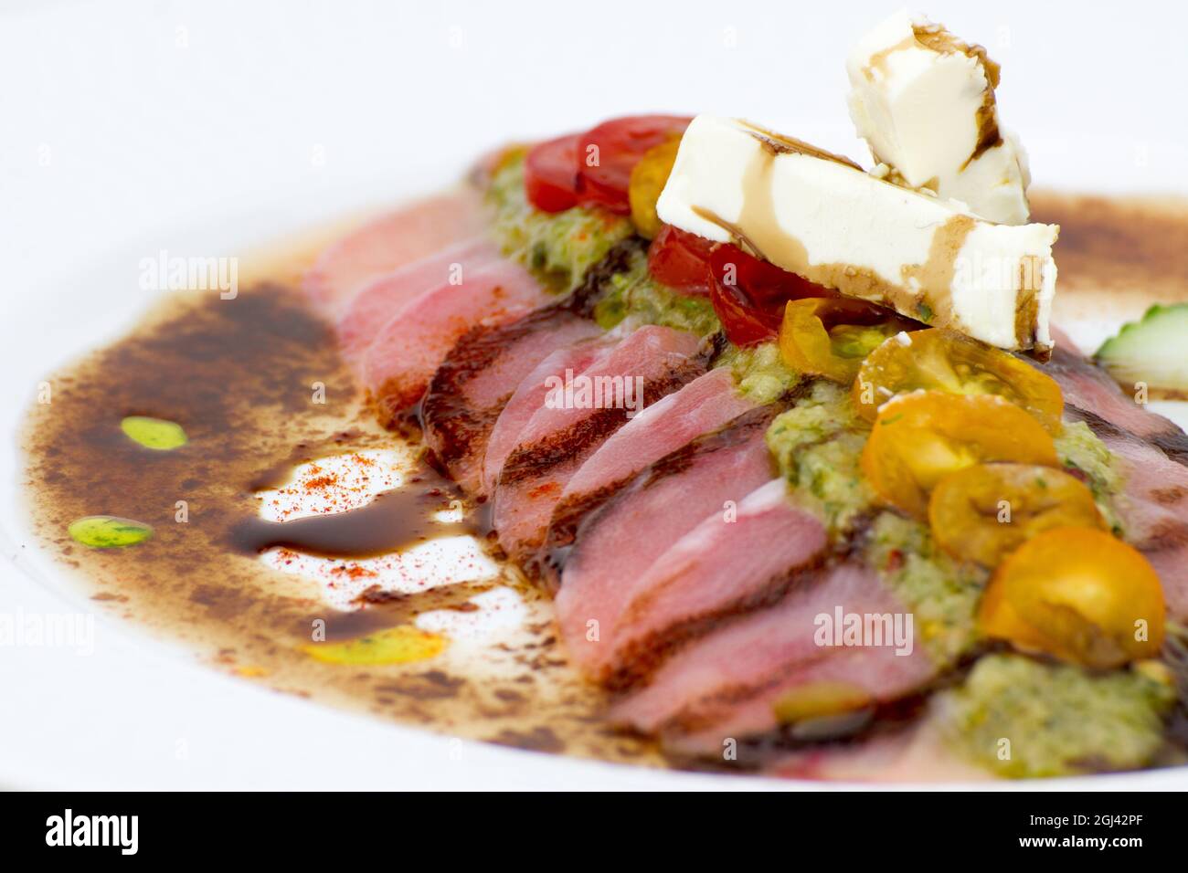 Gourmet food plate with meat and feta Stock Photo - Alamy