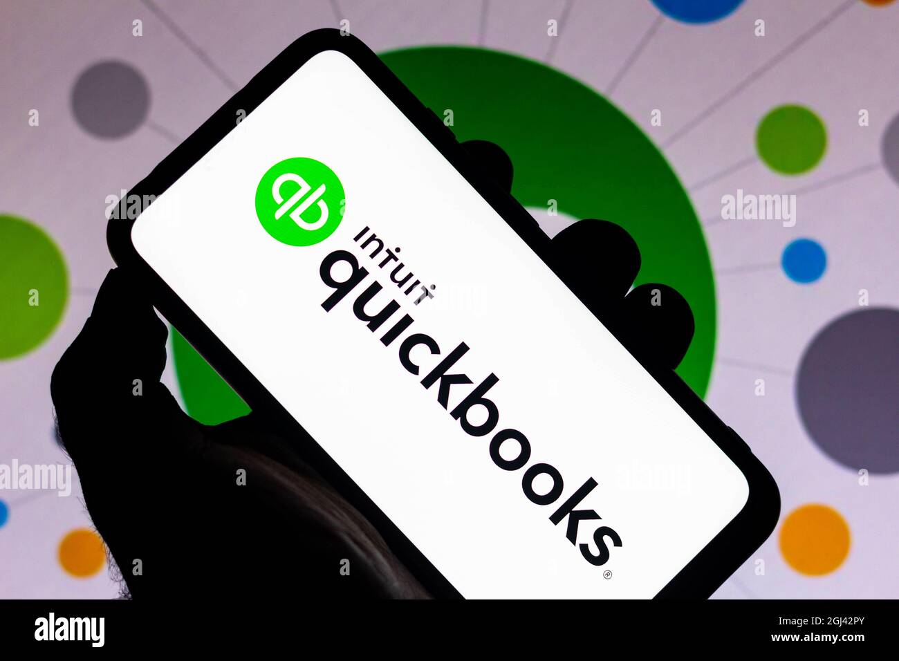 In this photo illustration the QuickBooks (Intuit) logo seen displayed ...