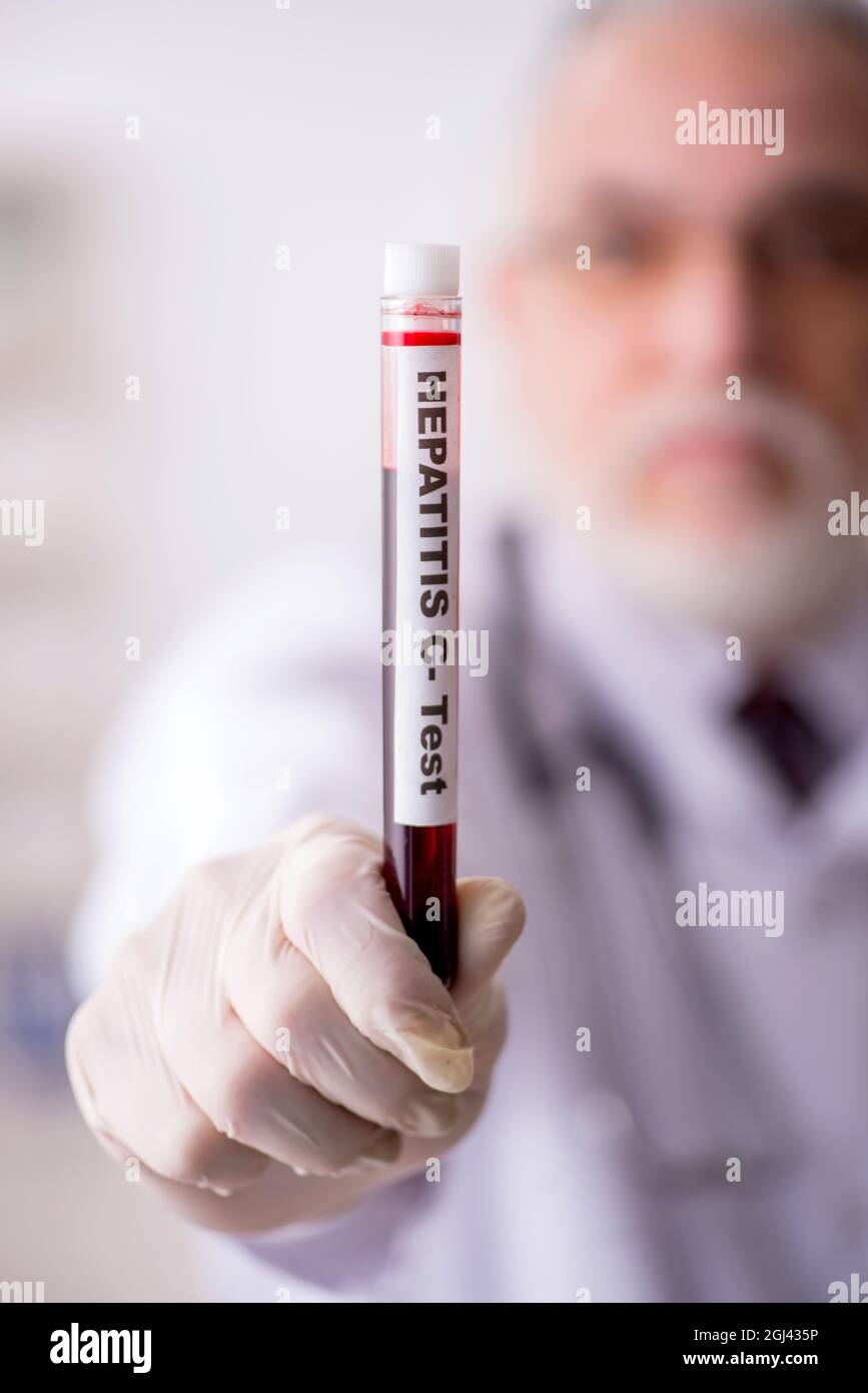 Hepatitis doctor showing blood sample hi-res stock photography and ...