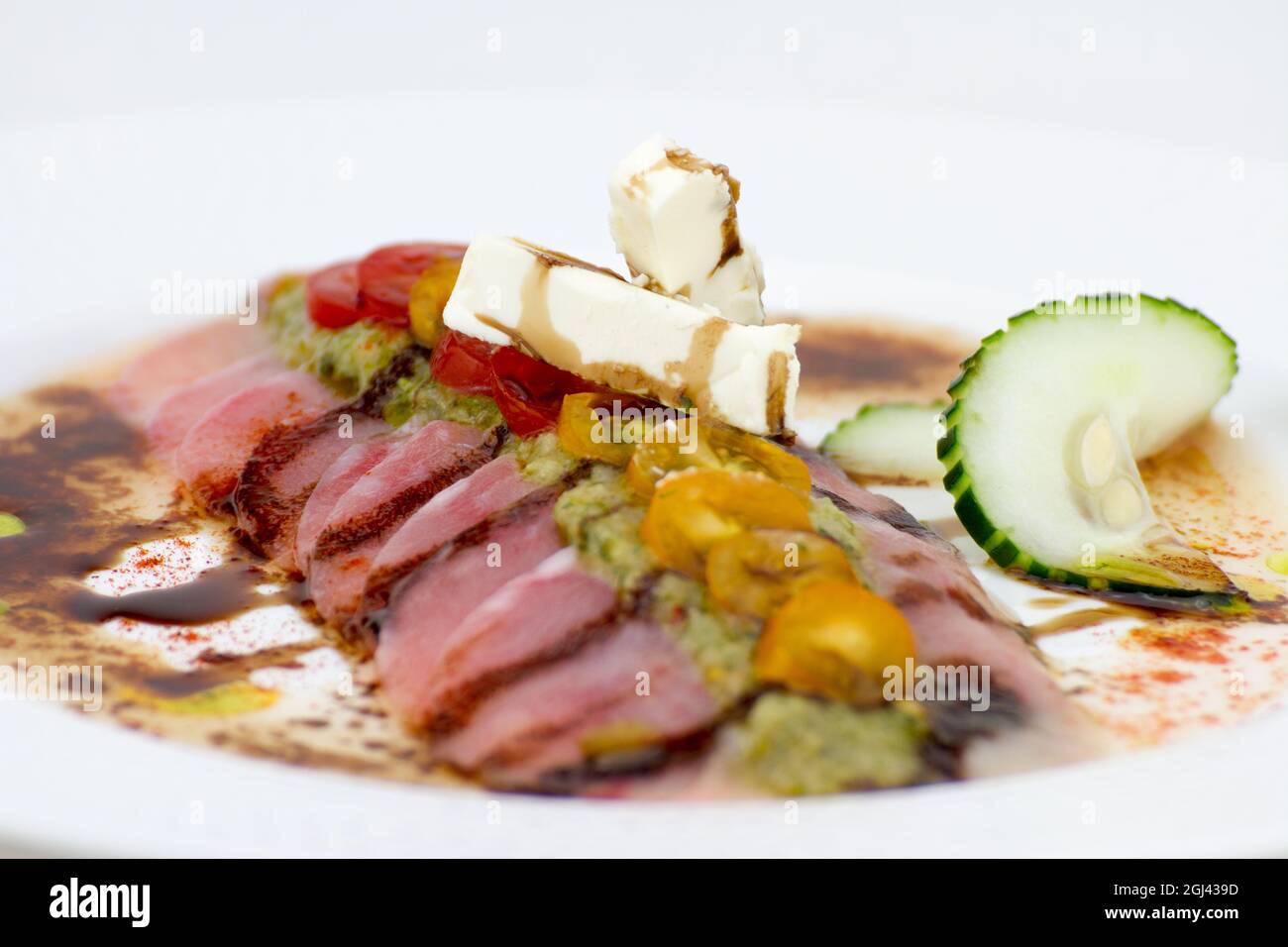 Gourmet food plate with meat and feta Stock Photo - Alamy