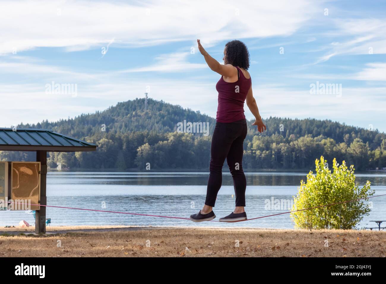Adventurous White Caucasian Adult Woman Walking on Slackline Stock ...