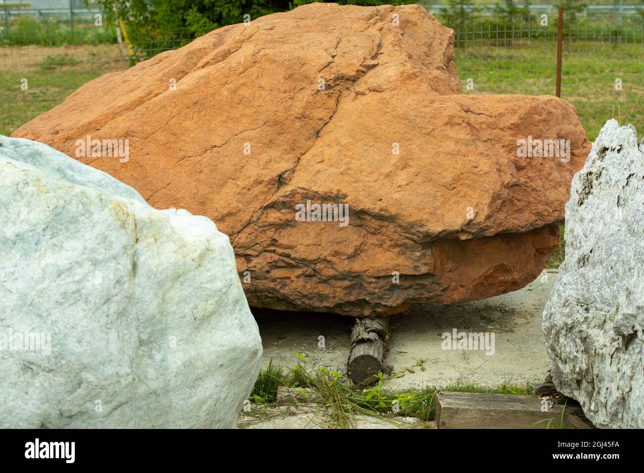 Red stone. Big cobblestone. A piece of rock to install in the garden ...