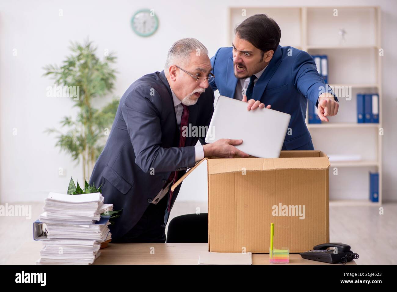 Two employees in dismissal concept Stock Photo - Alamy