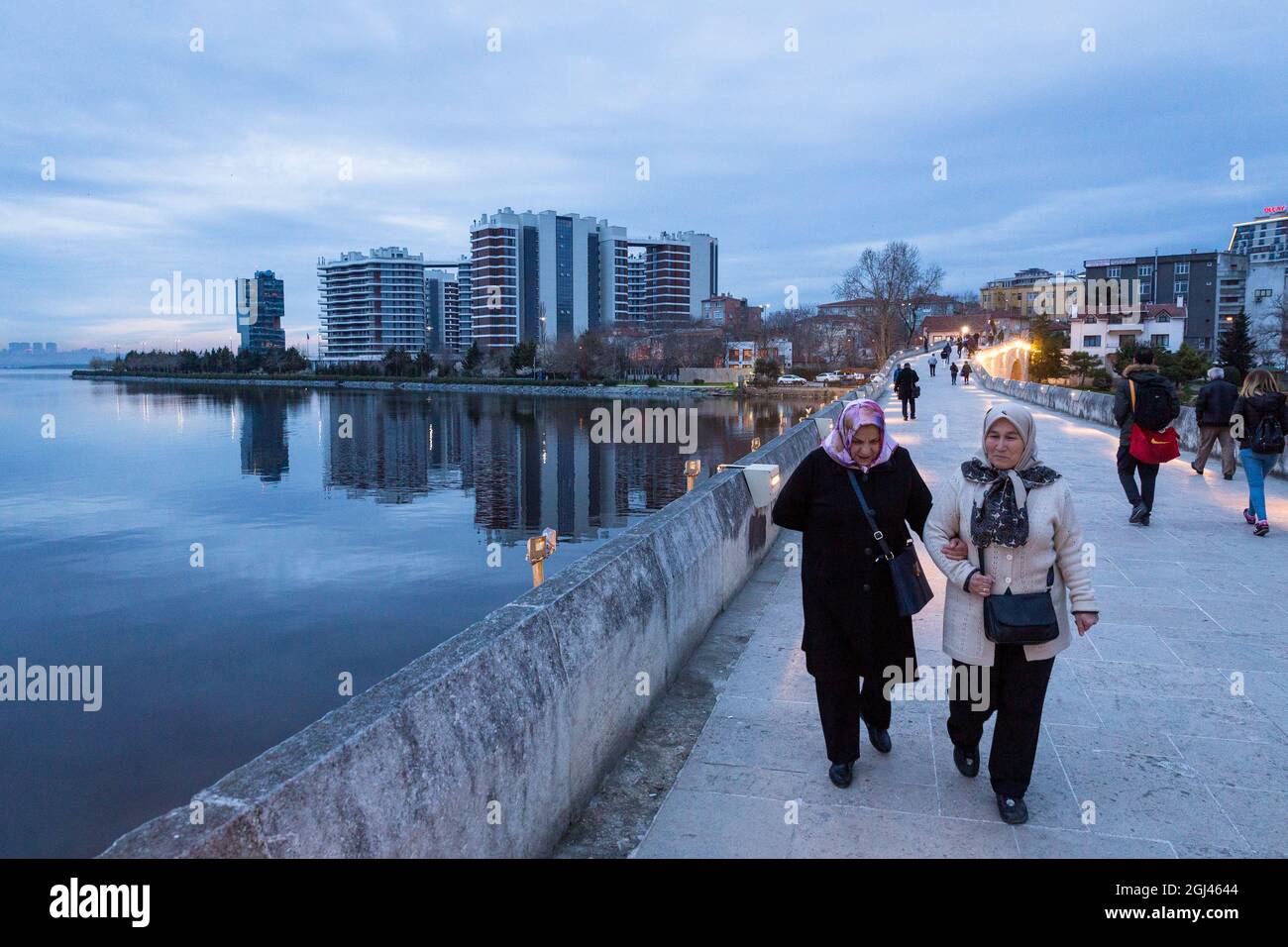 People on the historical Mimar Sinan Bridge in Kucukcekmece lake in ...