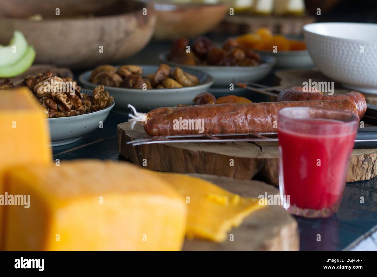 Breakfast buffet of cheese, sausage fruits and omelettes Stock Photo ...