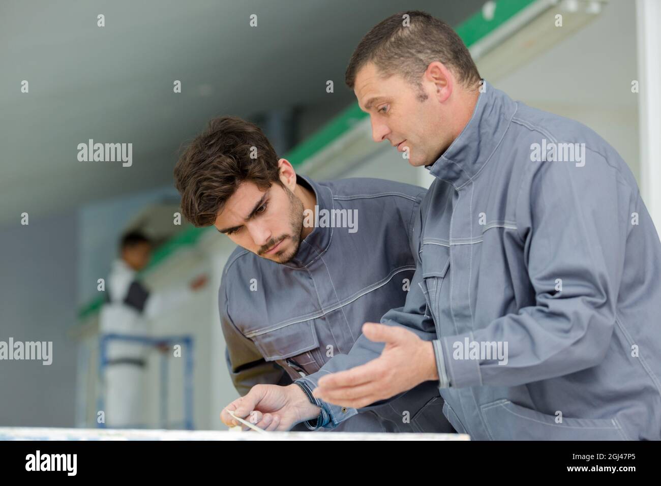modern industrial machine operators working in factory Stock Photo - Alamy