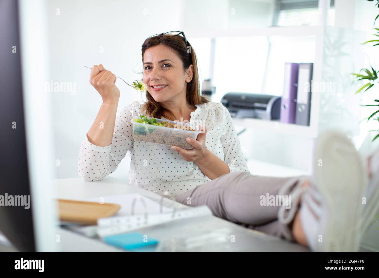 Fat office worker eating hi-res stock photography and images - Alamy