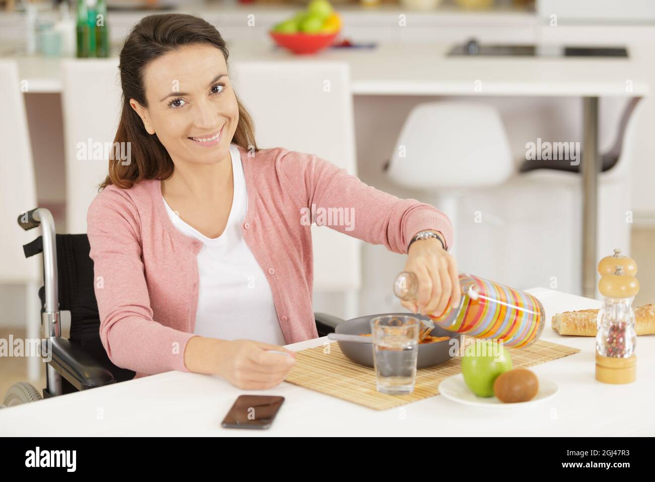 disabled woman eating meal at home Stock Photo - Alamy