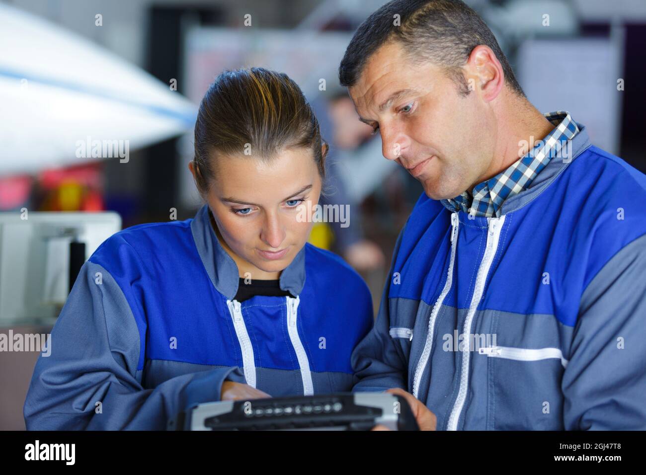 airplane service crew checking tablet Stock Photo - Alamy