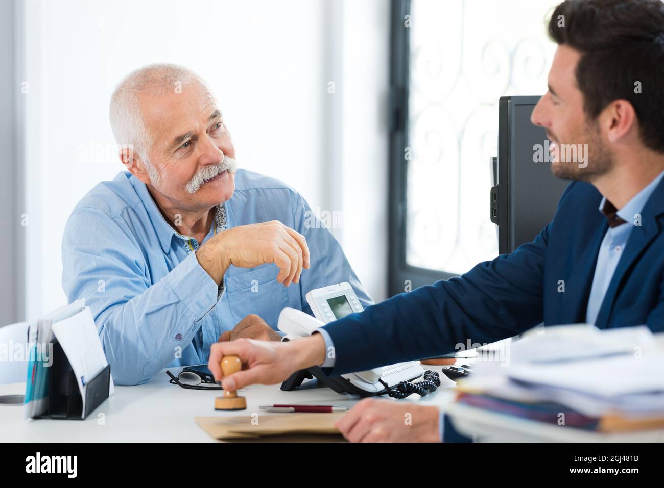 portrait of businessmen in the office Stock Photo - Alamy