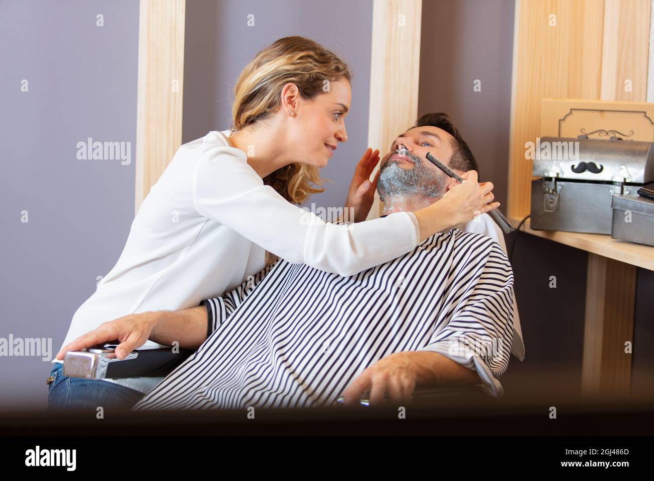 Female barber shaving hi-res stock photography and images - Alamy