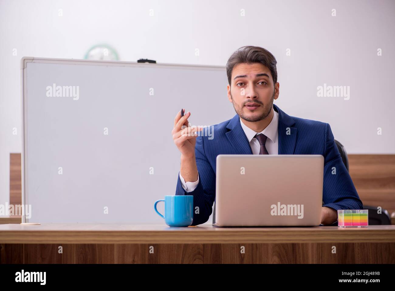 Young attractive employer in teleconference concept Stock Photo - Alamy