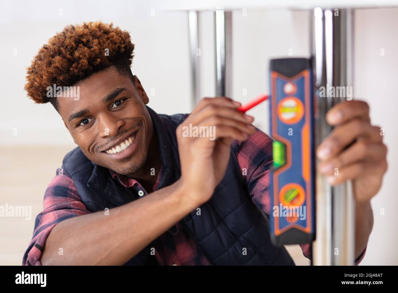 male worker using spirit level Stock Photo - Alamy