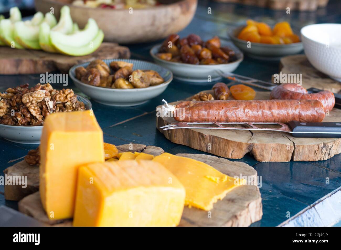 Breakfast buffet of cheese, sausage fruits and omelettes Stock Photo ...
