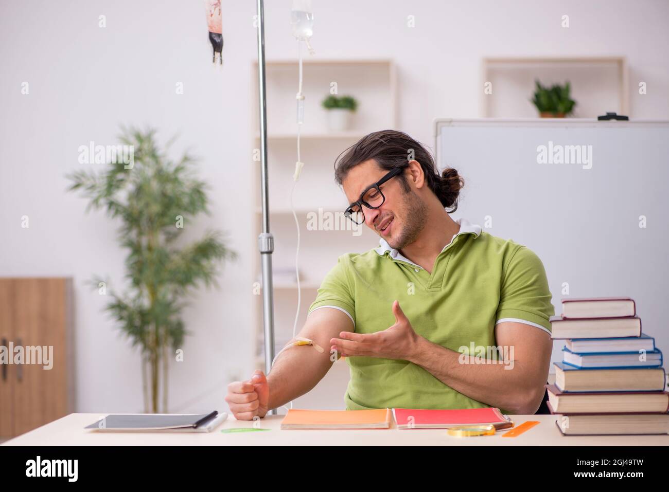 Young sick teacher student in blood transfusion concept Stock Photo - Alamy