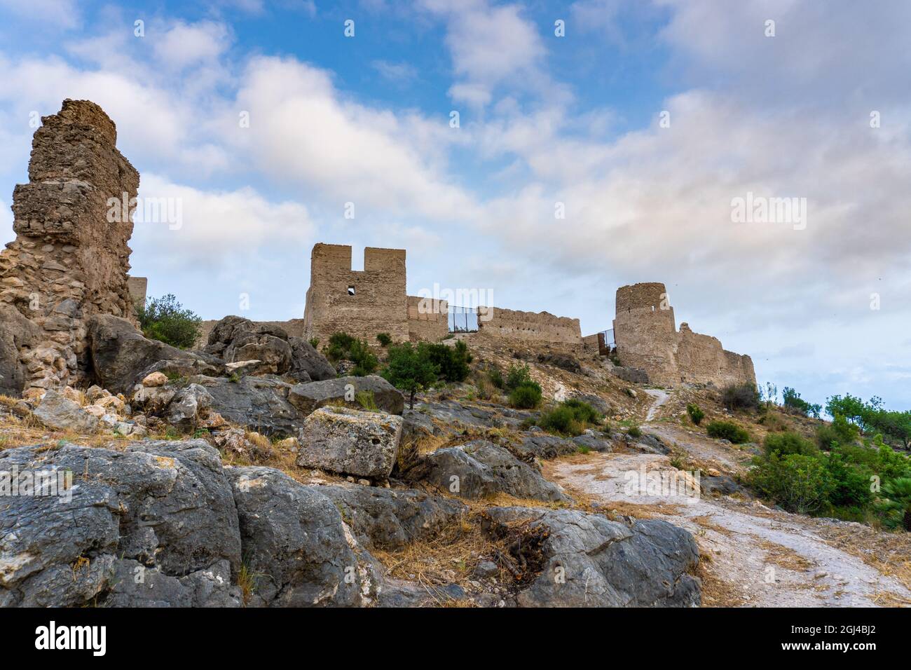 Beautiful view of an ancient old fortress partially destroyed under a ...