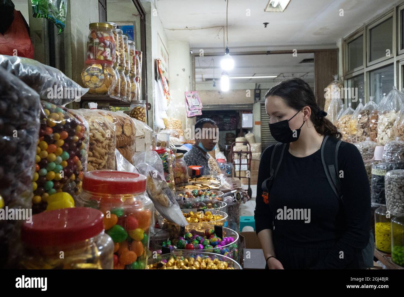 JAKARTA, INDONESIA - Aug 17, 2021: A young female trying to choose ...