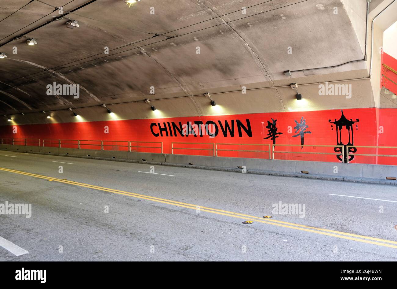 Chinatown painted in black block letters on orange colored brick ...