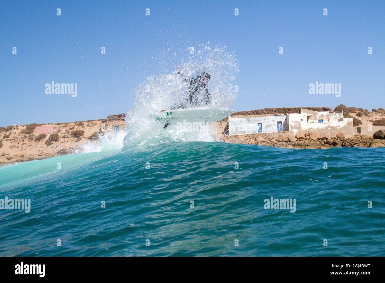 Surfer getting air in Morocco Stock Photo - Alamy