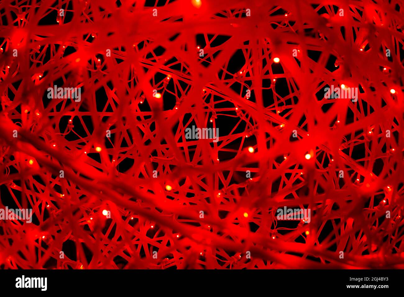 Red LEDs in the web. The texture of the web in bright light. The woven ...