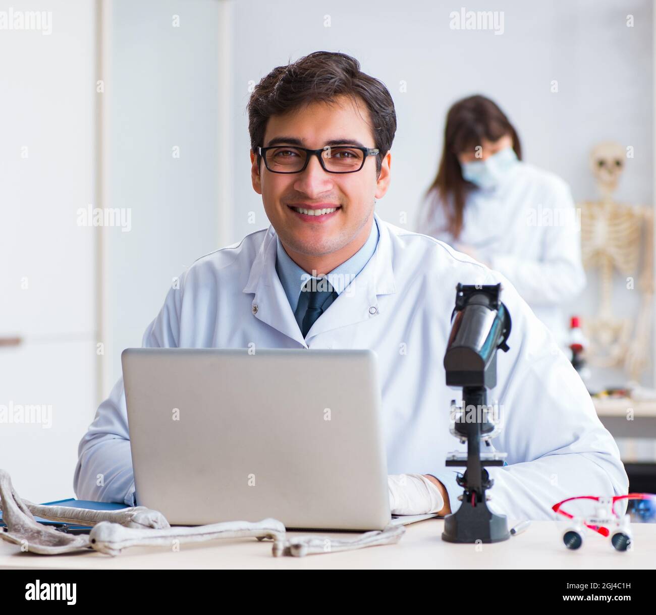 The professor studying human skeleton in lab Stock Photo - Alamy
