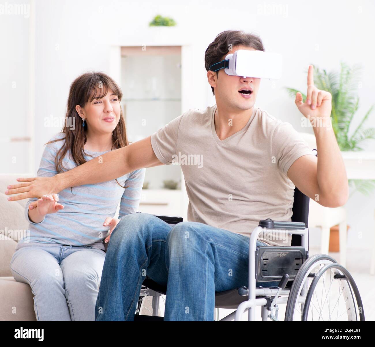 The disabled man with virtual glasses Stock Photo - Alamy