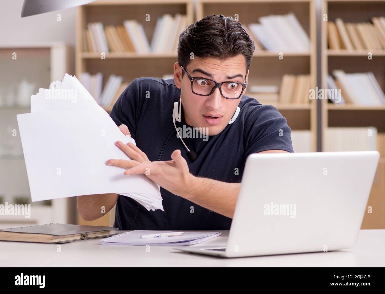The angry man with too much paperwork to do Stock Photo - Alamy