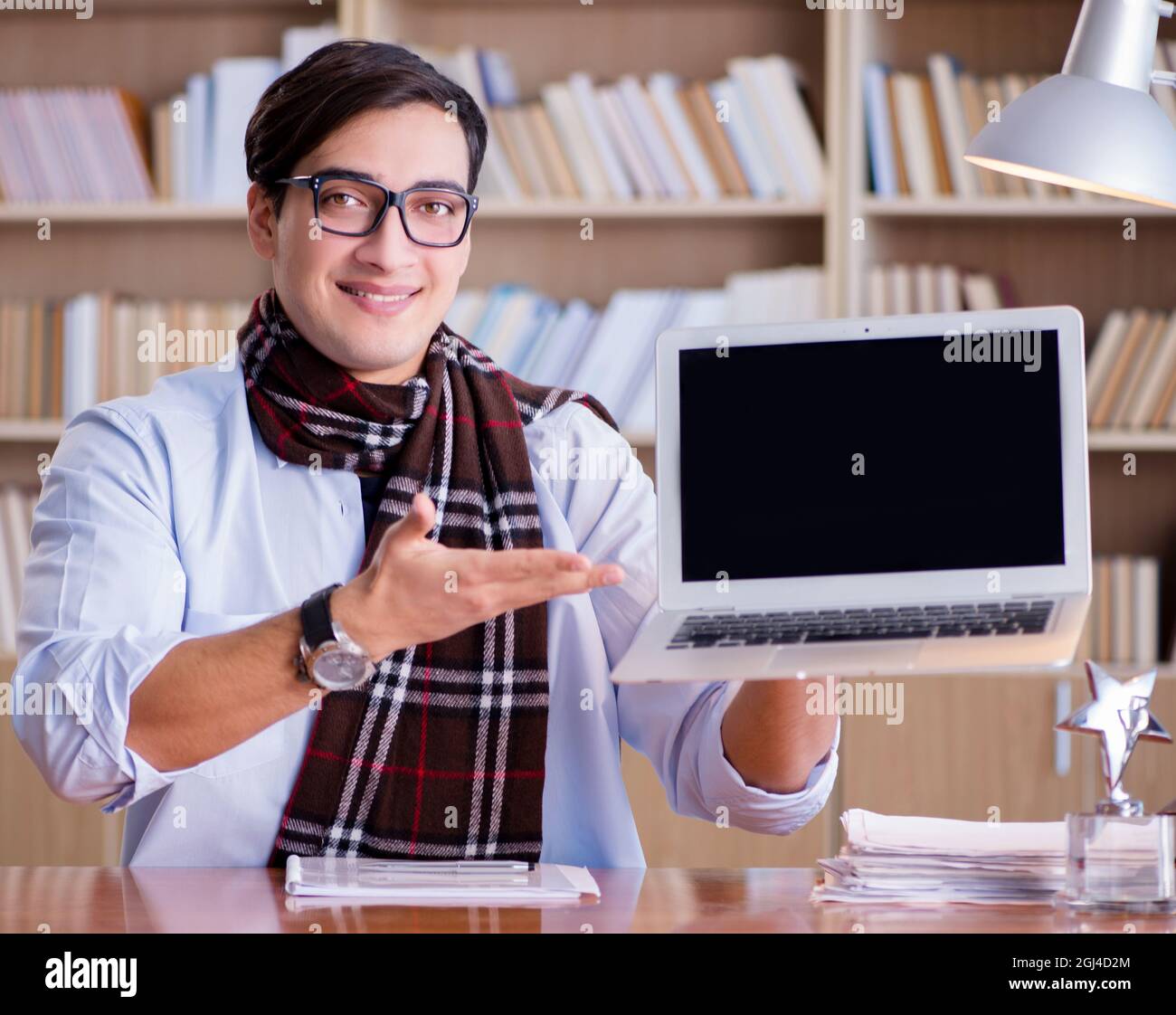 The young writer working in the library Stock Photo - Alamy